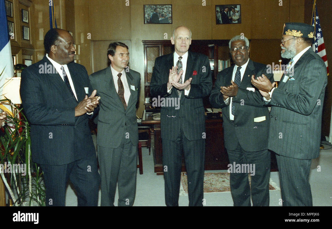 FIVE MEN ARE STANDING IN THE OFFICE CLAPPING THERE HANDS Stock Photo ...