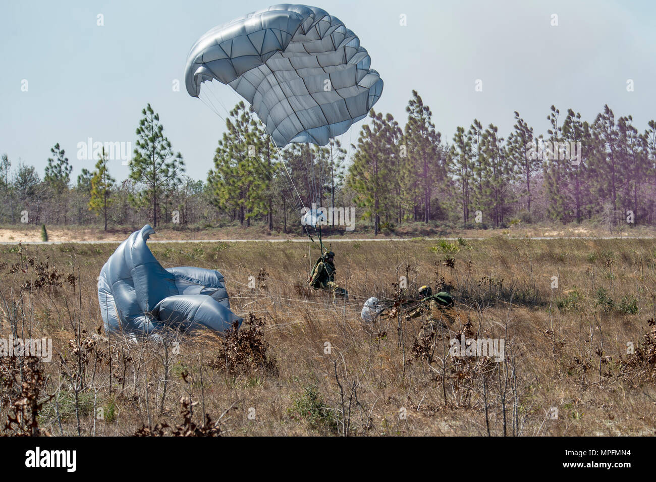 U.S. Air Force Airmen from the 24th Special Operations Wing land after ...