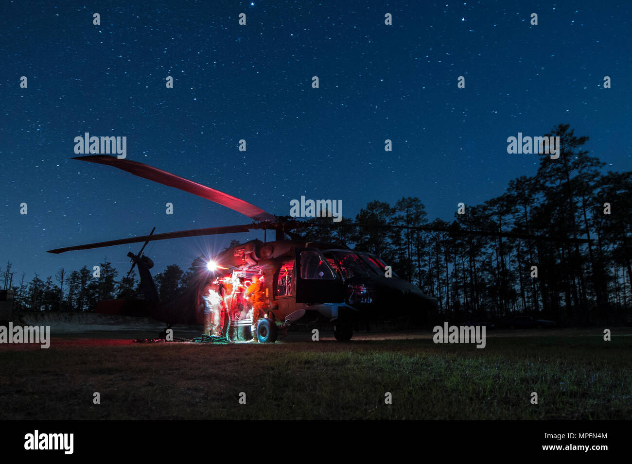 U.S. Army Soldiers assigned to the 7th Special Forces Group attach a ...