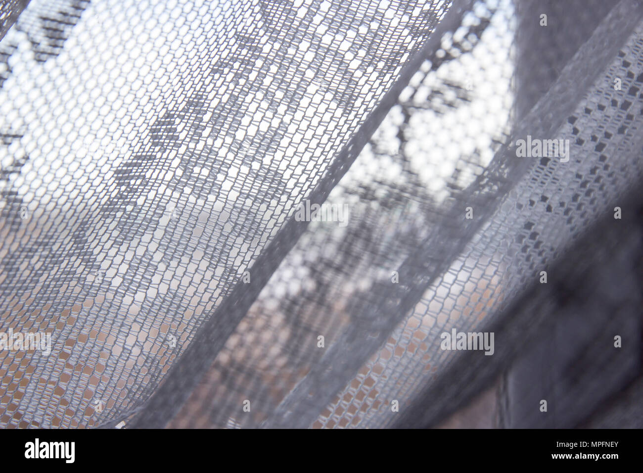Vintage folding vintage net and with flowers macro Stock Photo - Alamy
