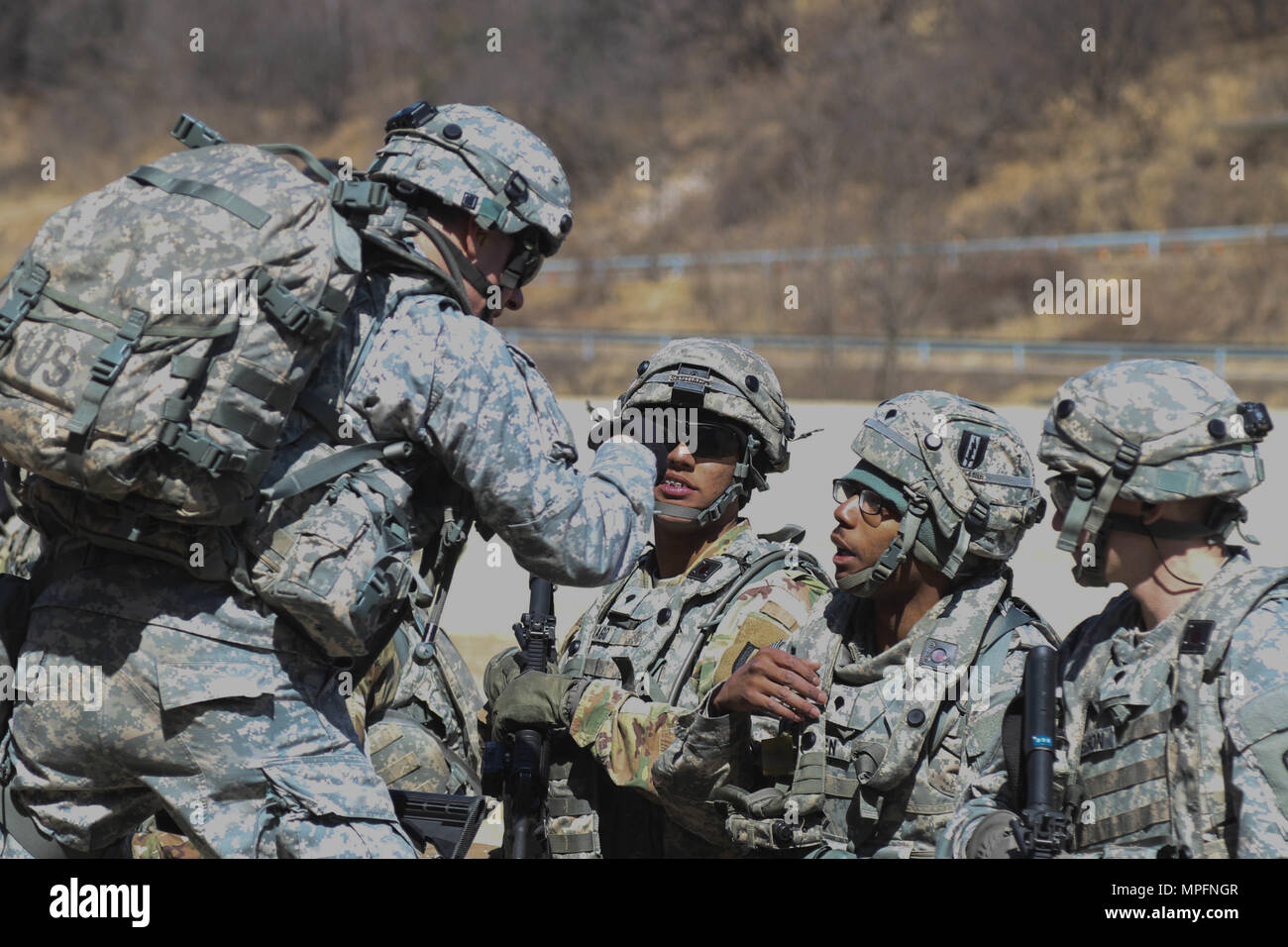 A Basic Leader Course class leader gives instructions to fellow ...
