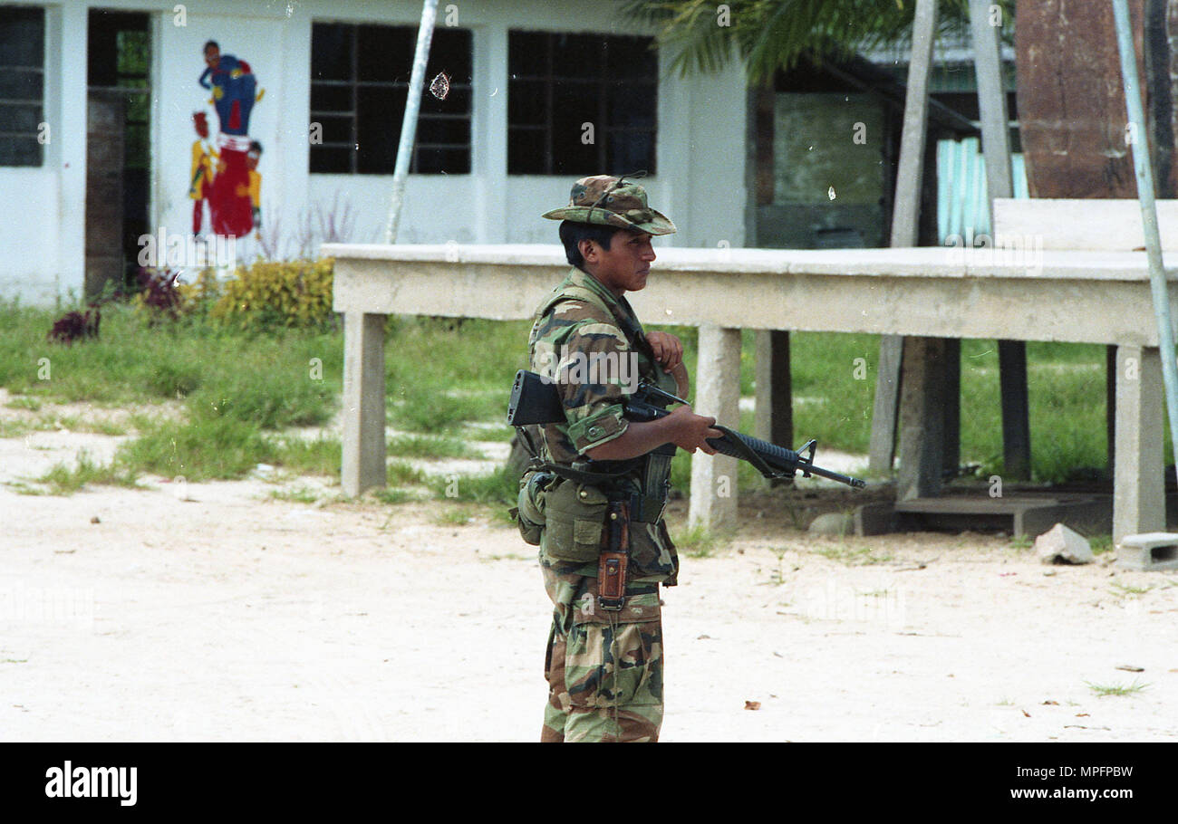 man in military uniform with a gun Stock Photo - Alamy