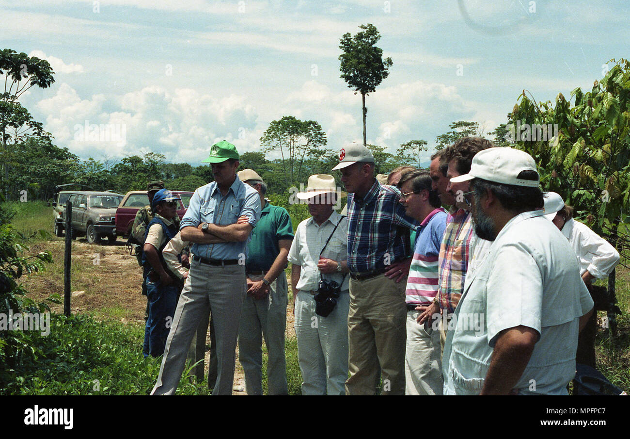men gathered around crops Stock Photo - Alamy