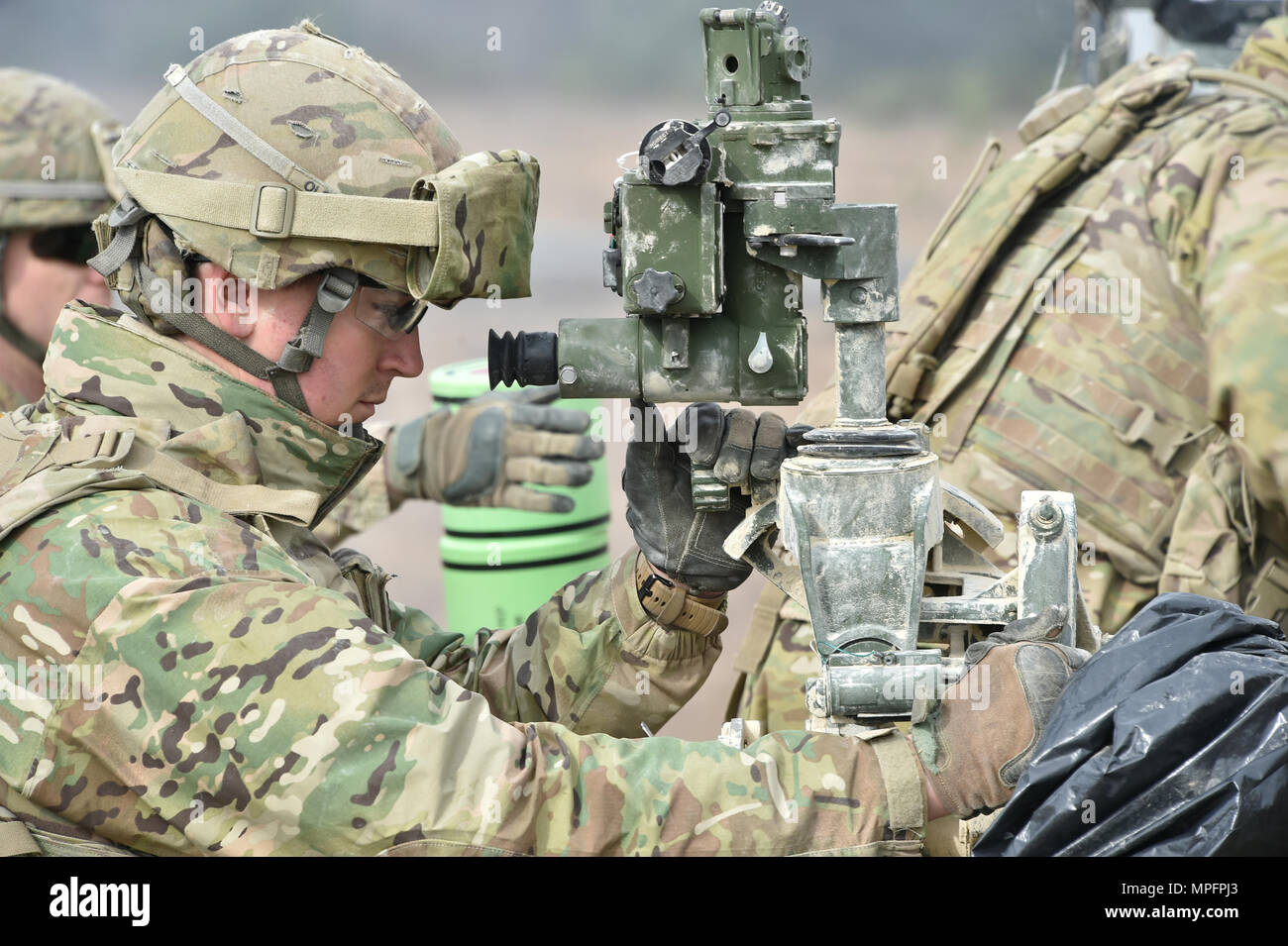 Soldiers from Cobra Battery, 2nd Cavalry Regiment, fire a M777 Howitzer ...