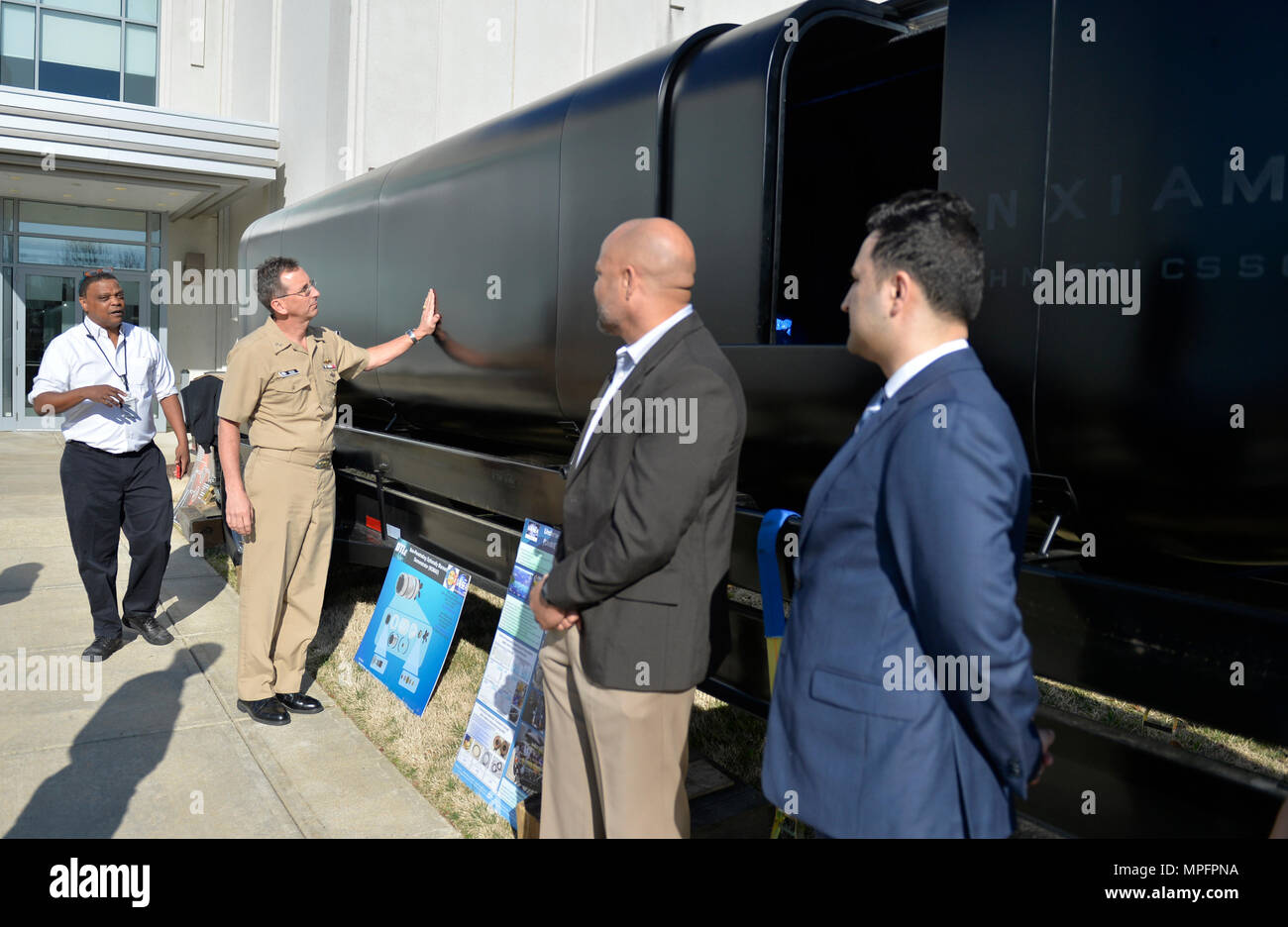 Chief of Naval Research Rear Adm. David Hahn listens as Garry Shields ...