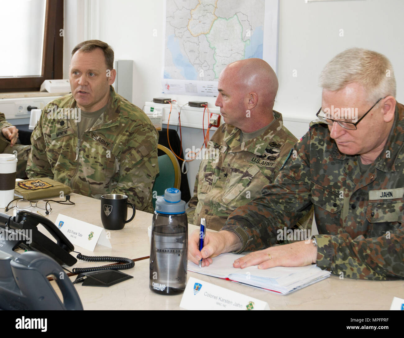 Lt. Col. Micahel A Mineni, left, chief of staff, 4th Infantry Division ...