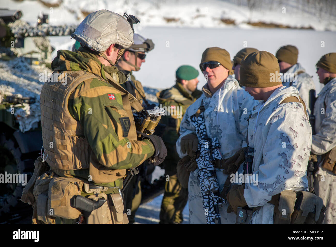 U.S. Marines with Marine Rotational Force Europe (MRF-E) interact with ...