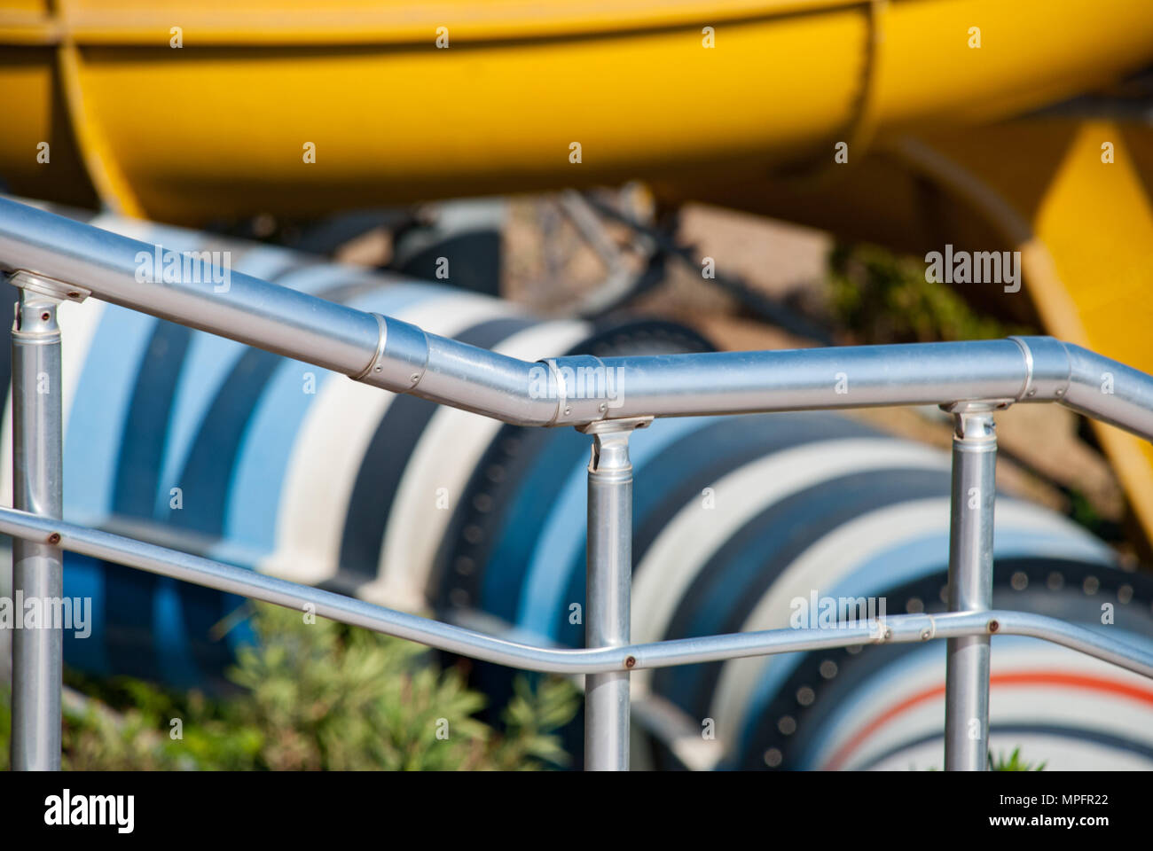Metal fence of stainless steel on water park background Stock Photo - Alamy