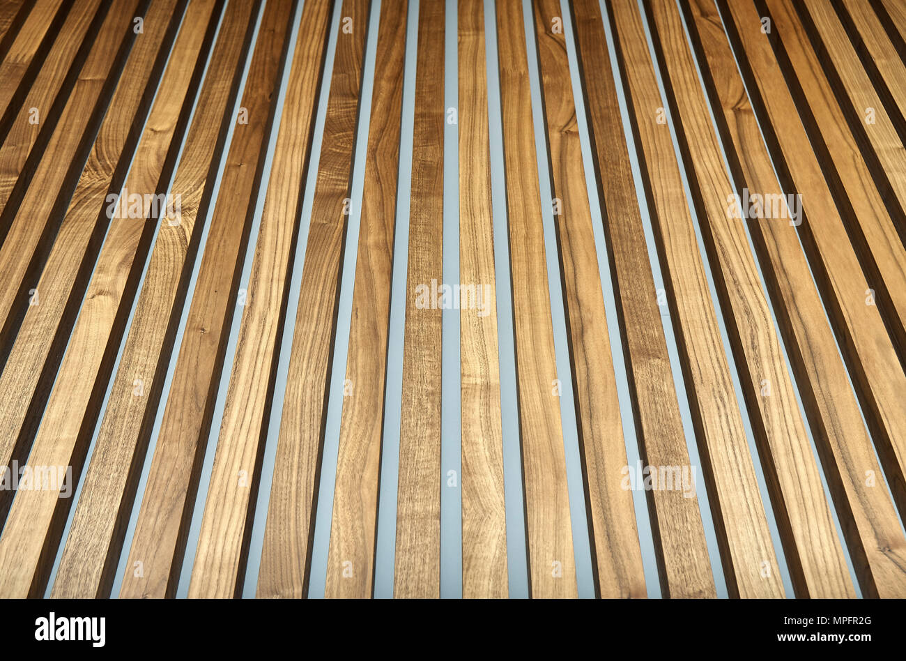 Walnut slats wall panel. Wooden slats on wall and ceiling in modern ...