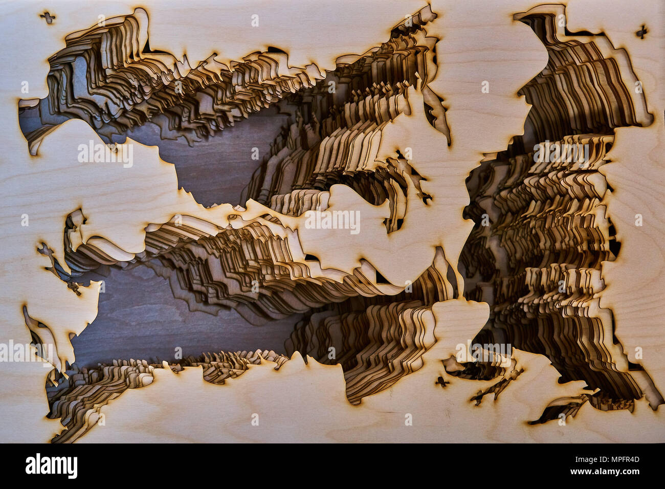 Laser cutting waste. Laser cut plywood map. Close-up Stock Photo - Alamy