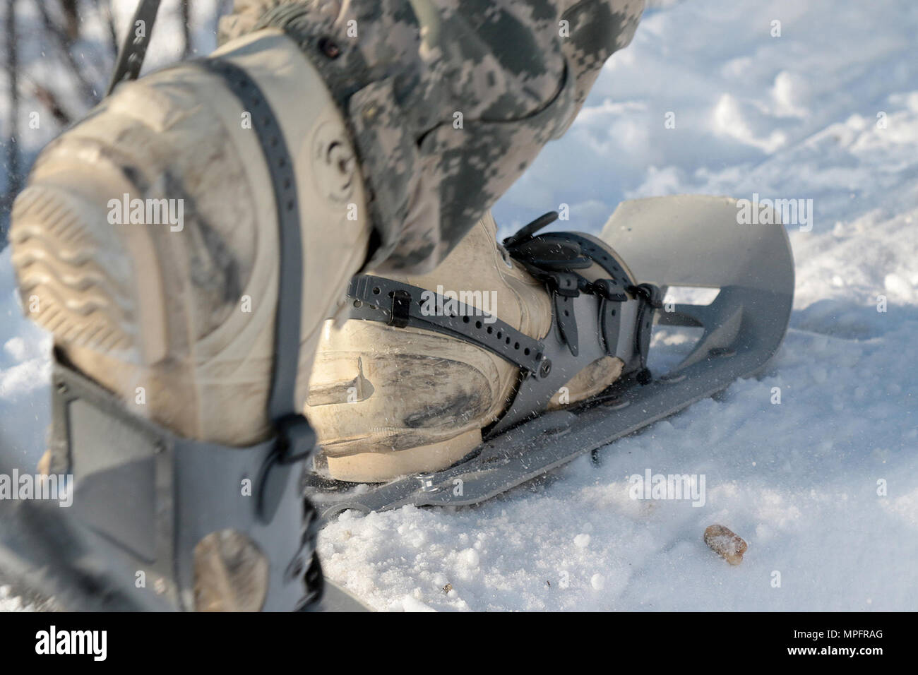 Soldiers snowshoe through the land navigation portion of U.S. Army ...