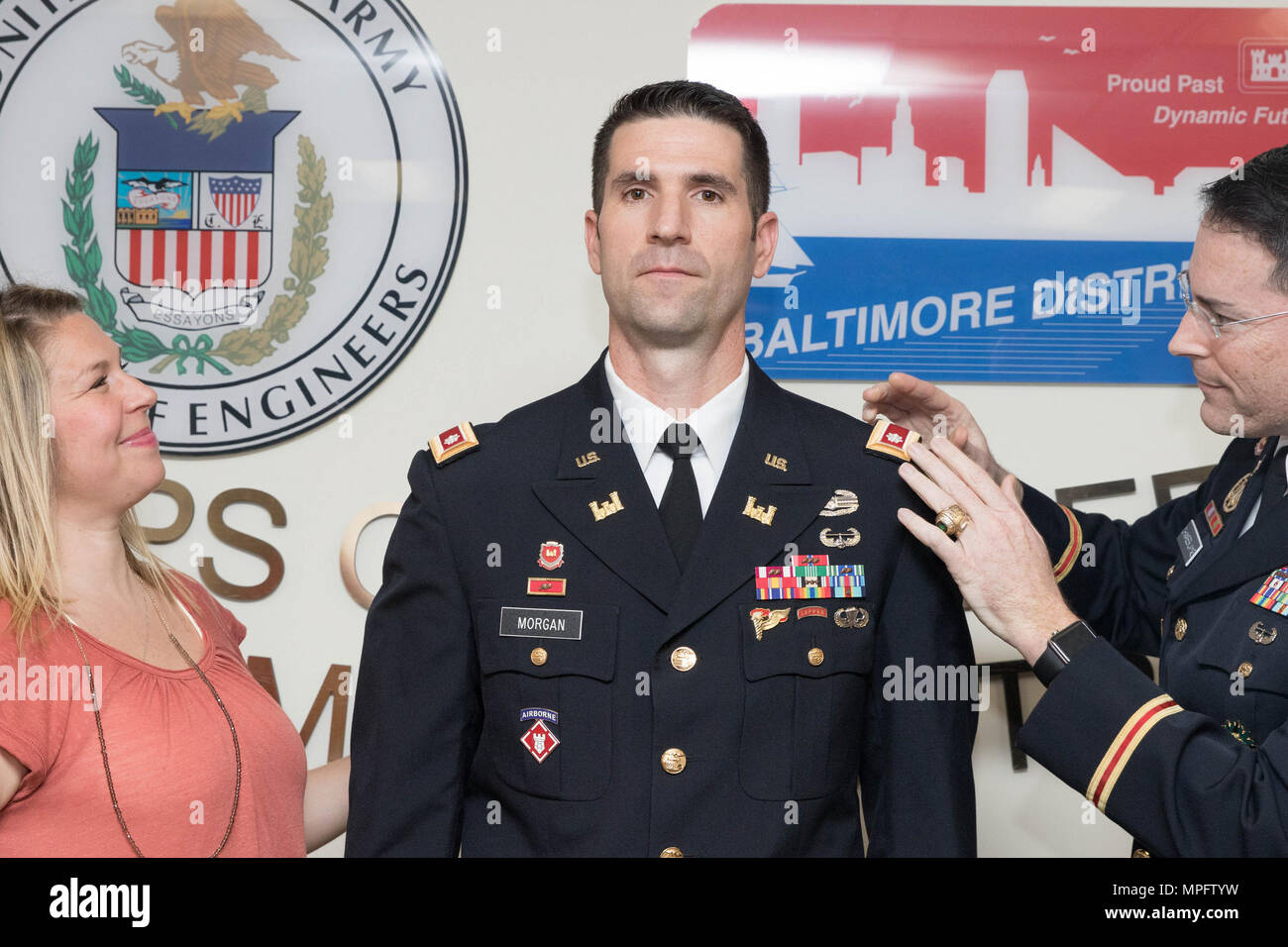 Col. Ed Chamberlayne, Baltimore District commander, places shoulder ...