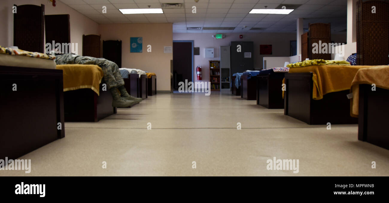 An Airman rests in the en-route patient staging facility at Al Udeid ...