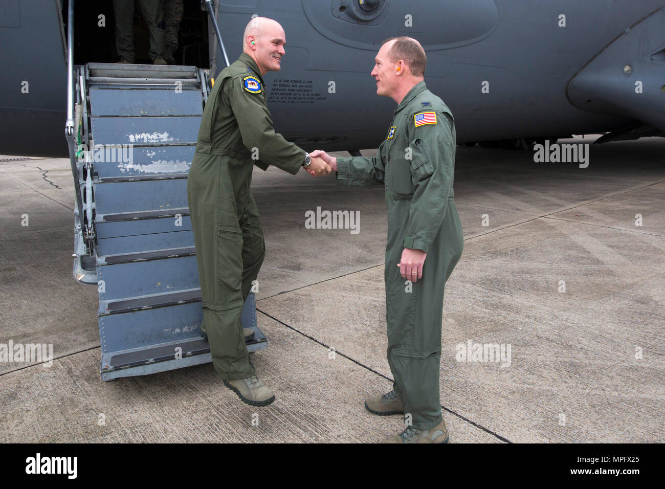 Col. Darren R. Cole, right, 305th Air Mobility Wing commander, greets ...