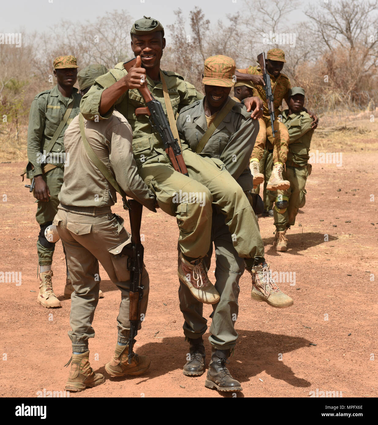 Burkina Faso soldiers have fun while practicing buddy carries during a ...