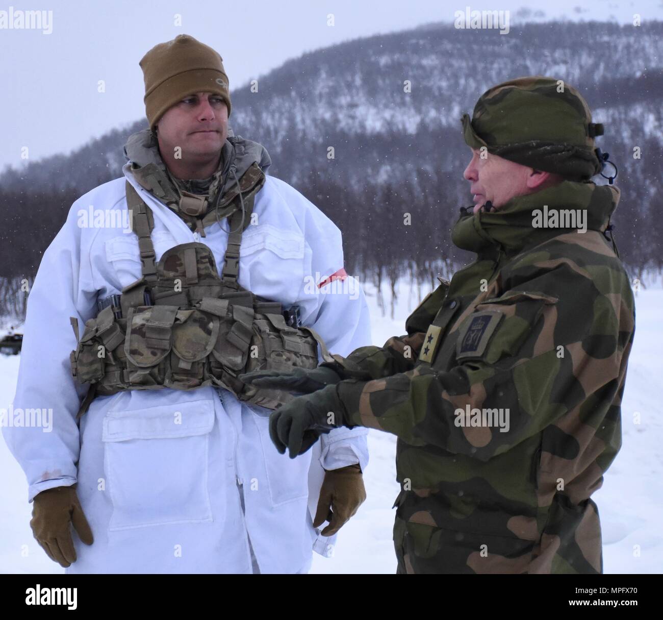 Maj. Gen. Odin Johannessen, Norwegian Army Chief of Staff, speaks with ...