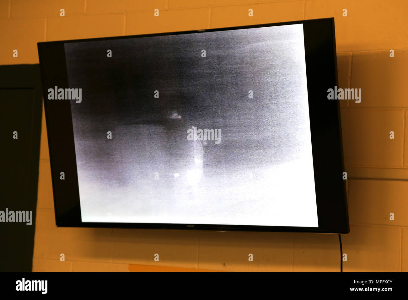 A television screen from a range camera captures Soldiers participating ...