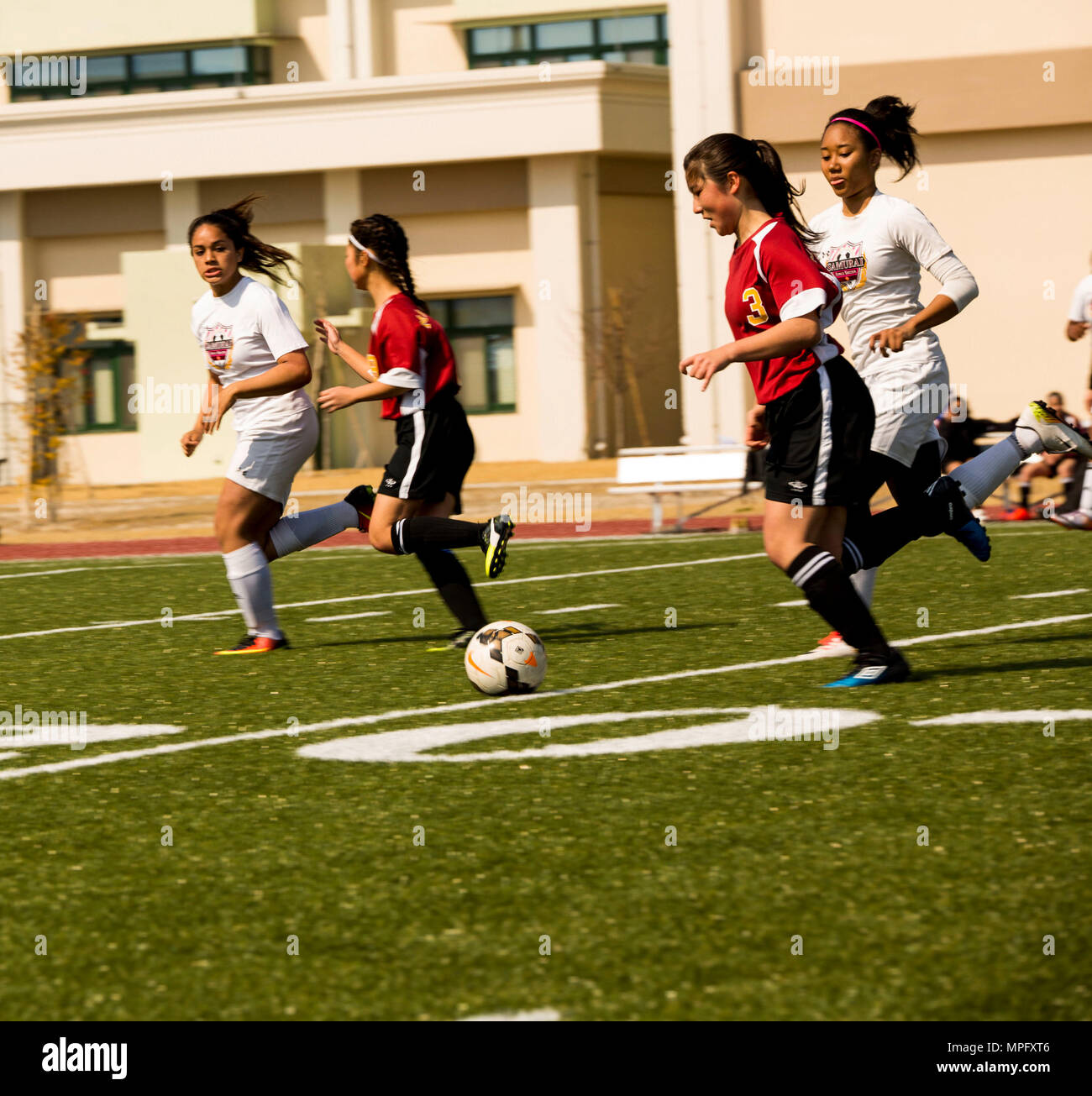 Matthew C. Perry Lady Samurai players attempt to secure the ball from ...