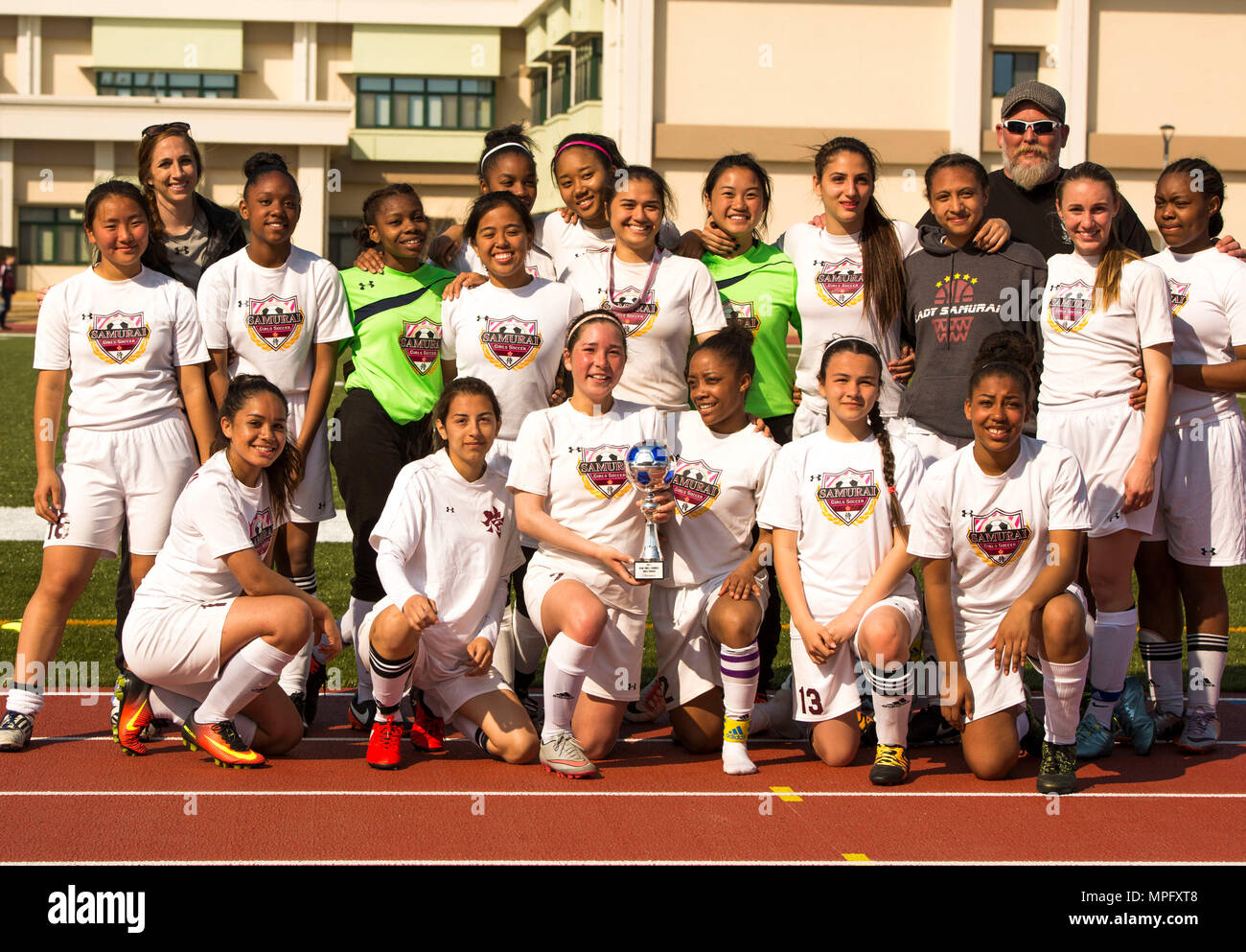 The Matthew C. Perry Lady Samurai soccer team poses for a photo during ...