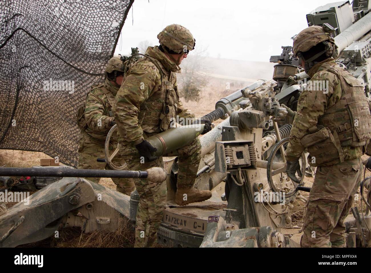 Sgt. Johnnie Morton, round runner for the gun crew of 1st Section, 1st ...