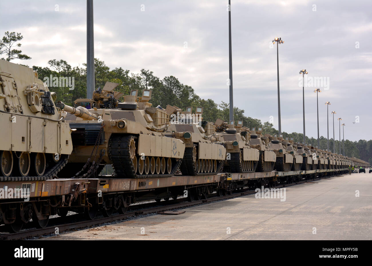 A line of M1A2 Abrams Main Battle Tanks, Bradley Fighting Vehicles and ...