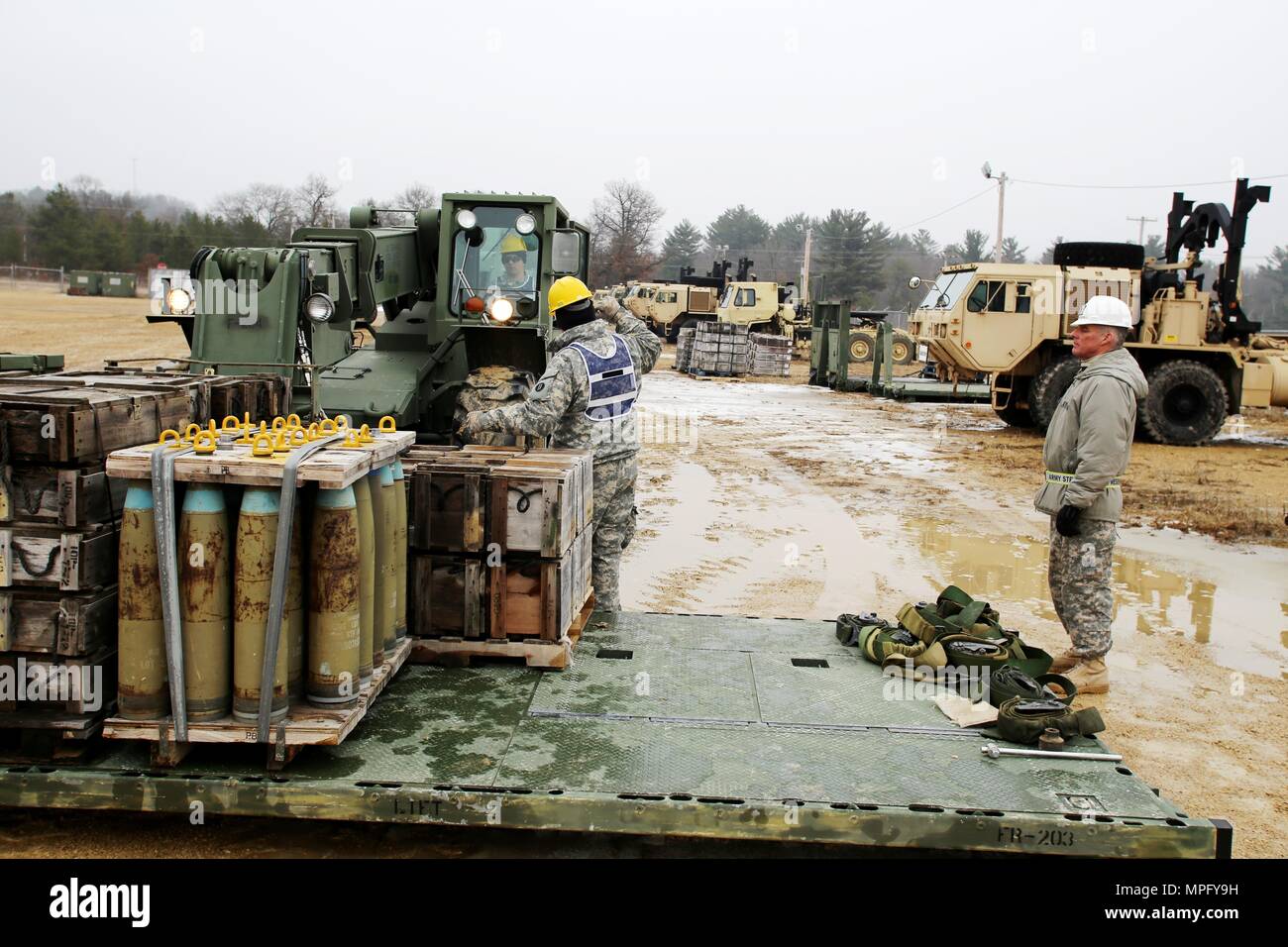 Sgt. 1st Class Michael Brown (right), an instructor with the 13th ...