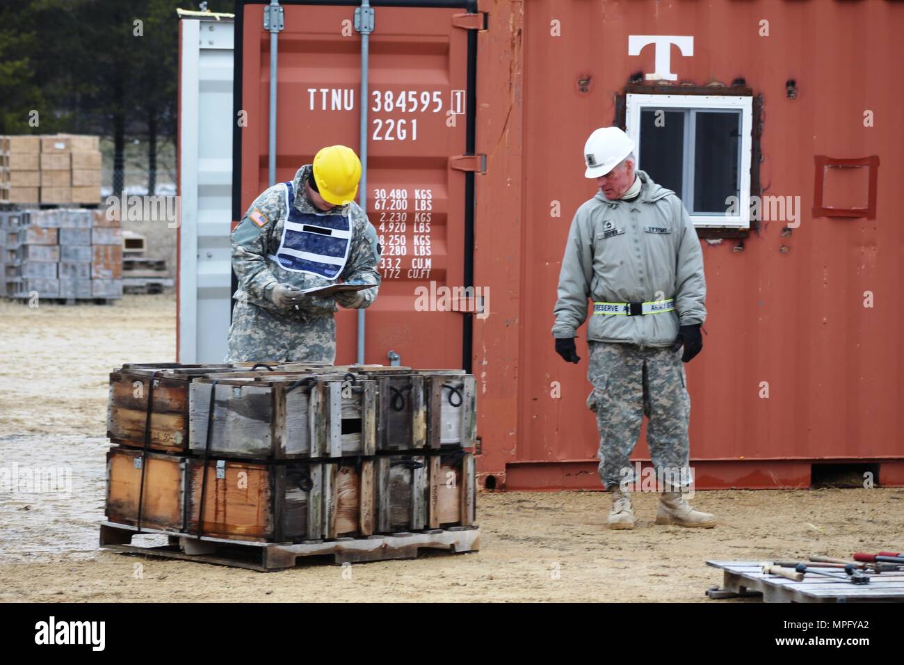 Sgt. 1st Class Michael Brown (right), an instructor with the 13th ...