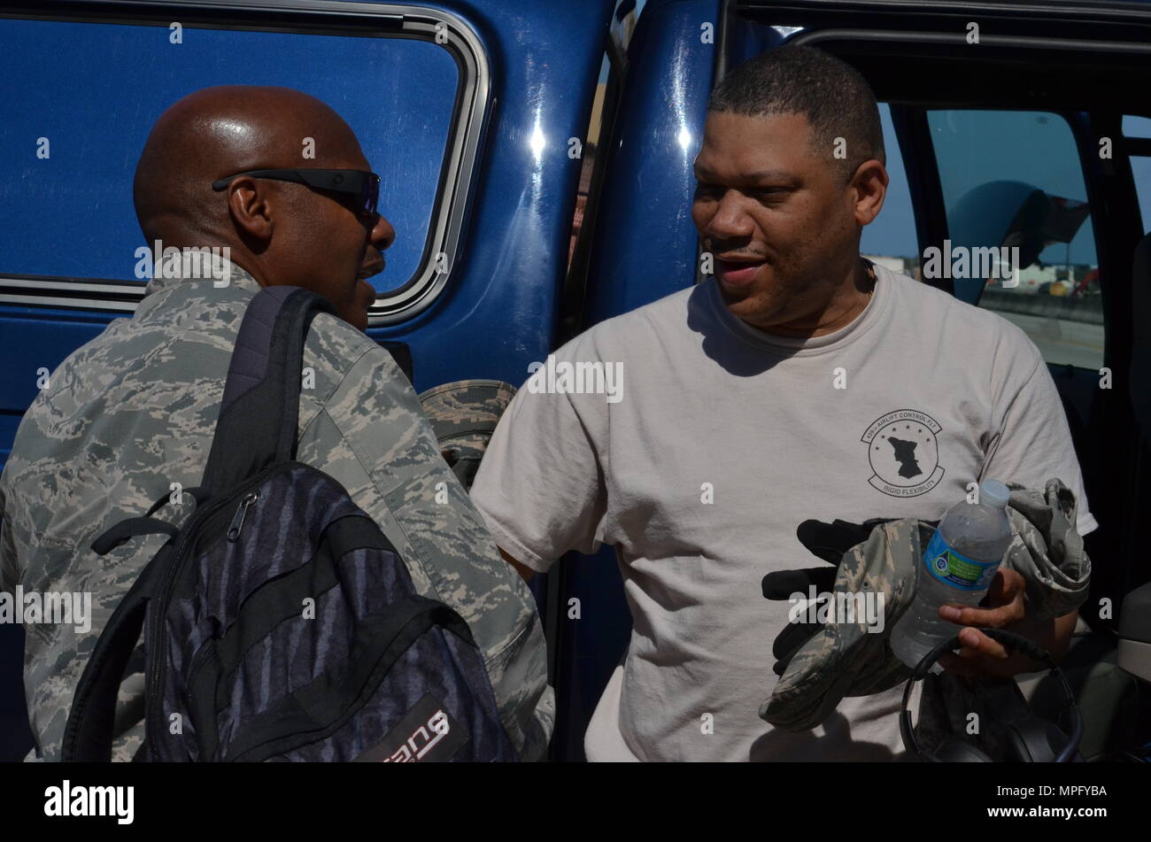 Lt. Col. Gordon Griggs, left, speaks with Master Sgt. Alexander Cotton ...