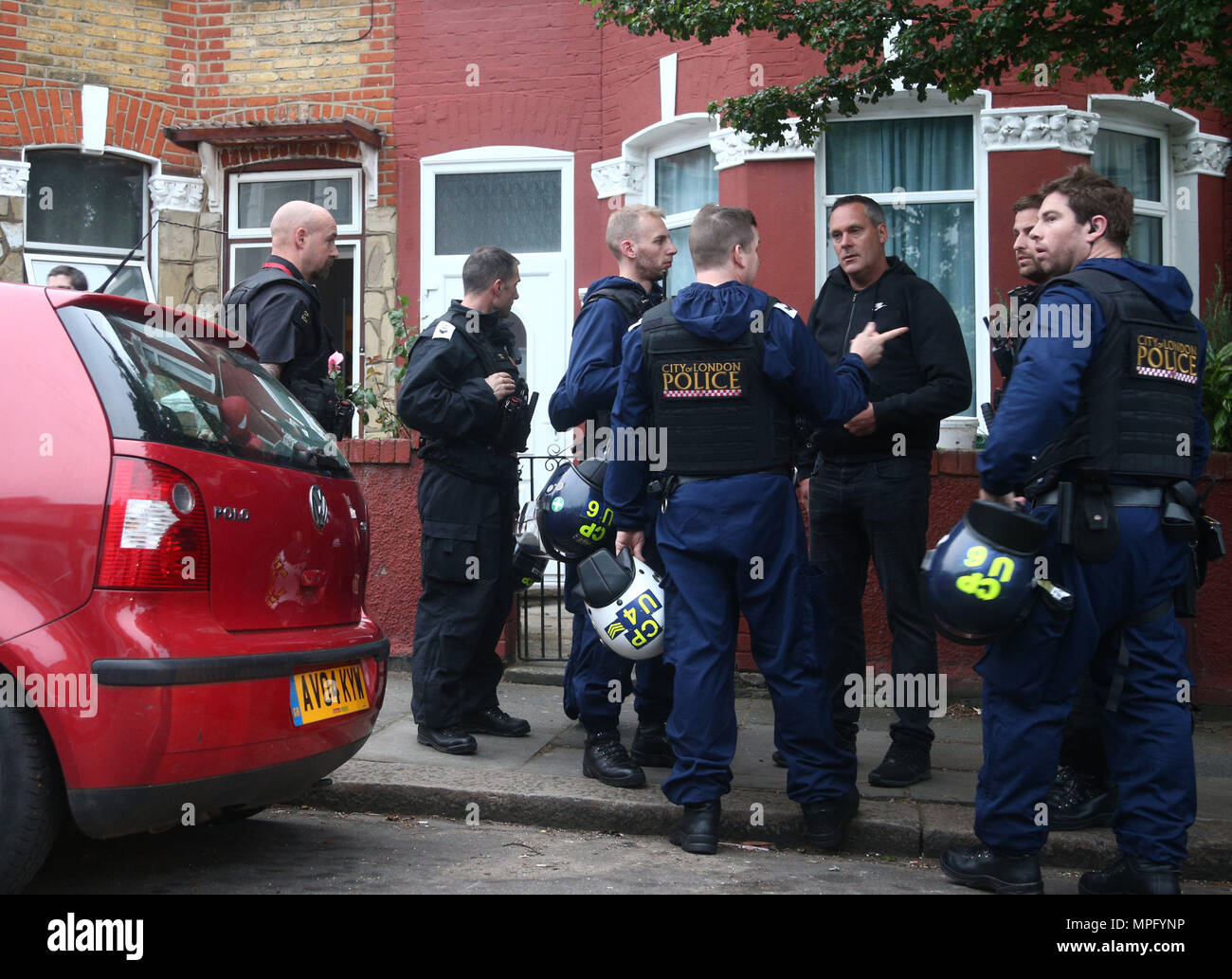 RETRANSMISSION, AMENDING PICTURE DATE TO TODAY. A dawn raid with police ...