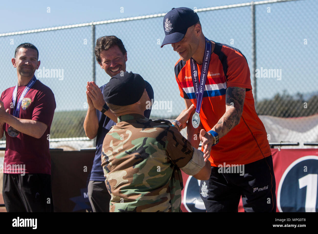 Dutch Lieutenant Col. Enrique Sanchez awards Sgt. Maj. Erik Schujer ...