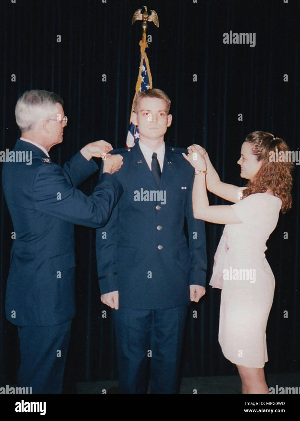 Col. David Miller, 341st Maintenance Group commander, center, pins on ...
