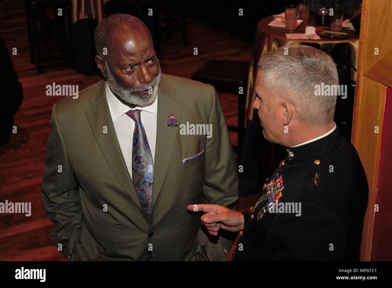 Major Gen. Paul Kennedy speaks to Dr. Dennis Thomas, commissioner of ...