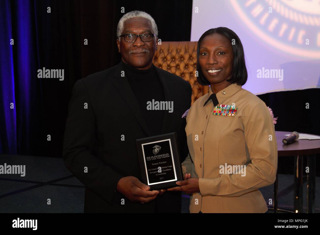 Lieutenant Col. Melanie Bell-Carter presents the Excellence in ...
