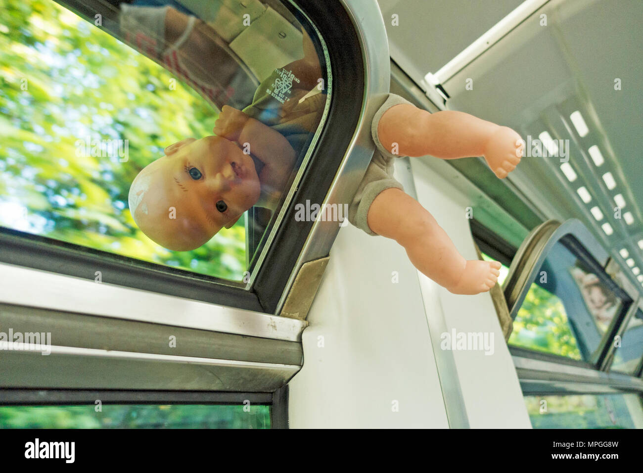 A baby, stuck in a window Stock Photo - Alamy
