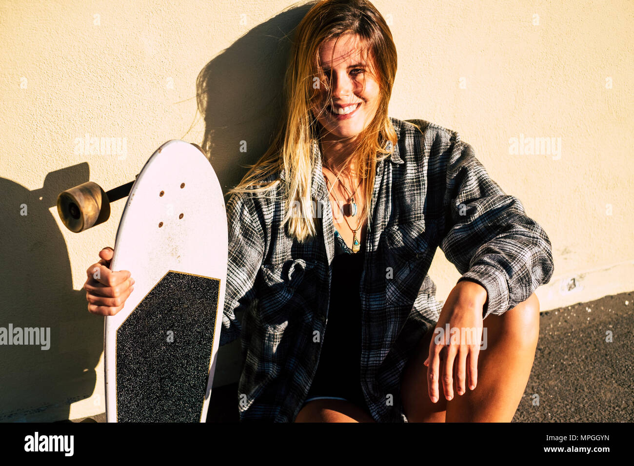 beautiful blonde girl 24 years old smiling at the camera sitting down ...