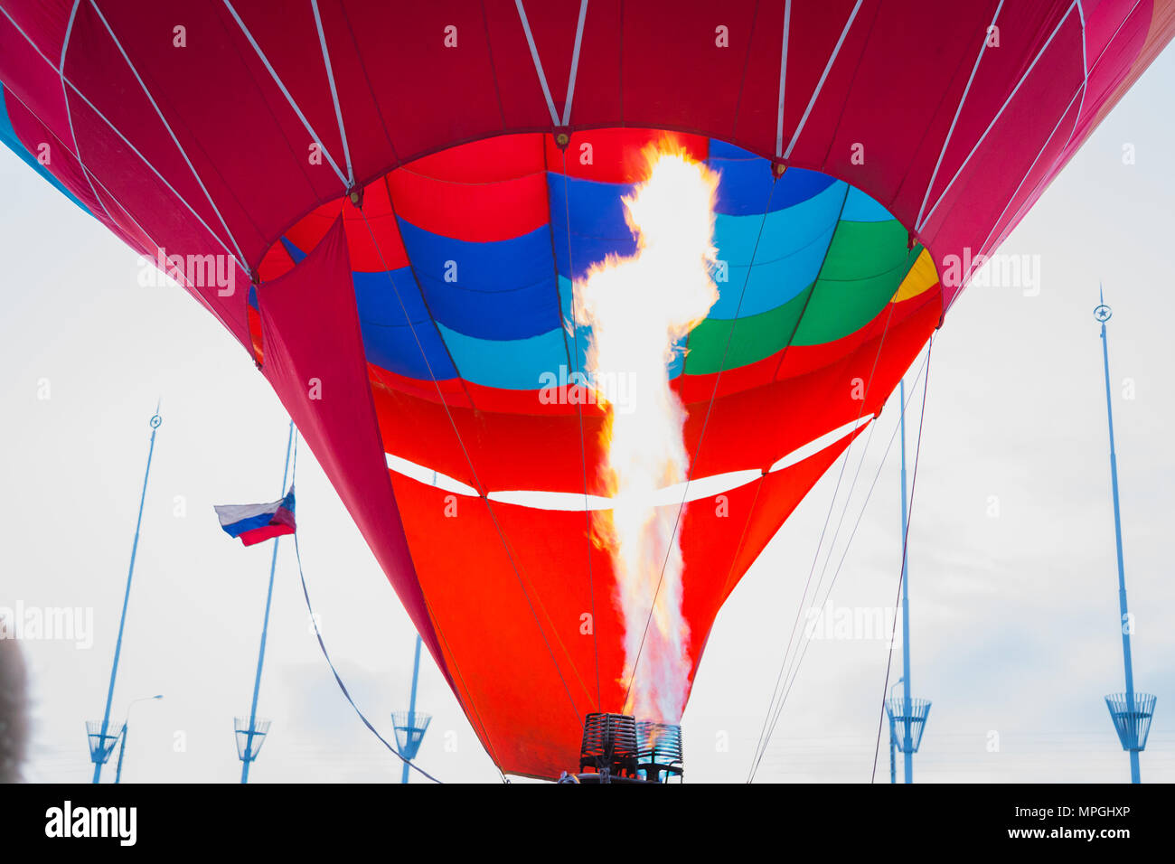 Balloon crew inflates envelope of hot air balloon at festival Stock ...