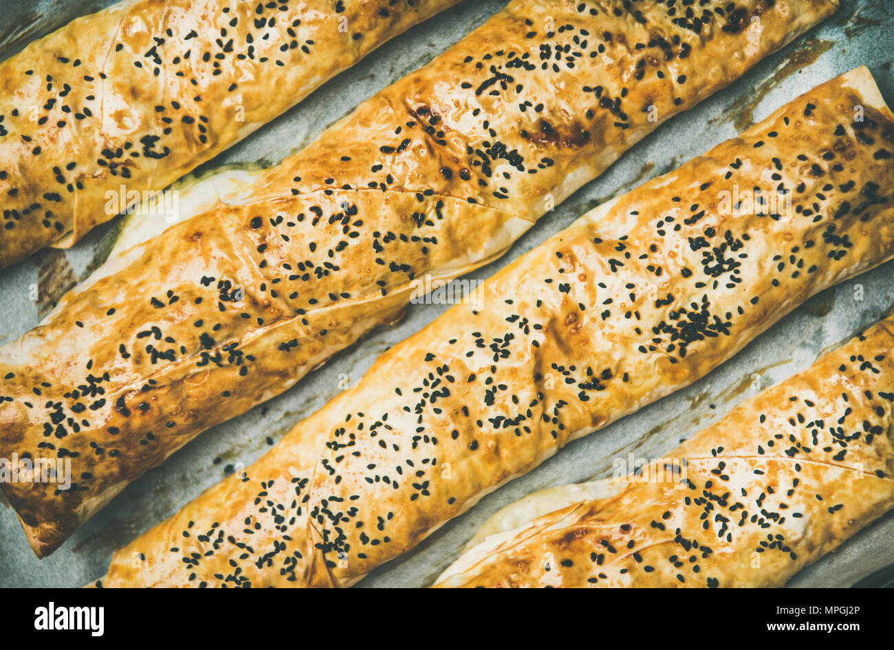 Freshly baked Turkish borek pastry rolls with spinach, top view Stock ...