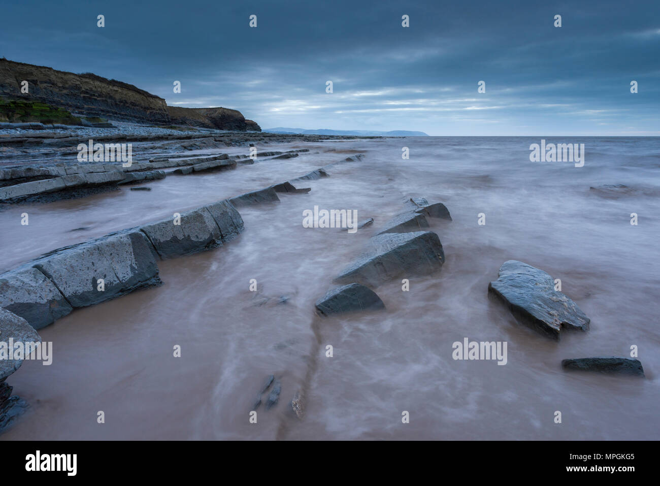Limestone rock ledges on the shore of the Bristol Channel at Kilve ...