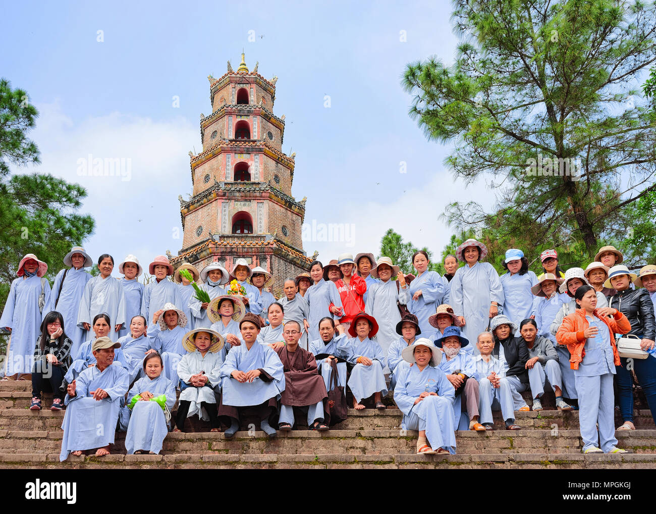 Hue, Vietnam - February 19, 2016: People sitting on the stairs at ...
