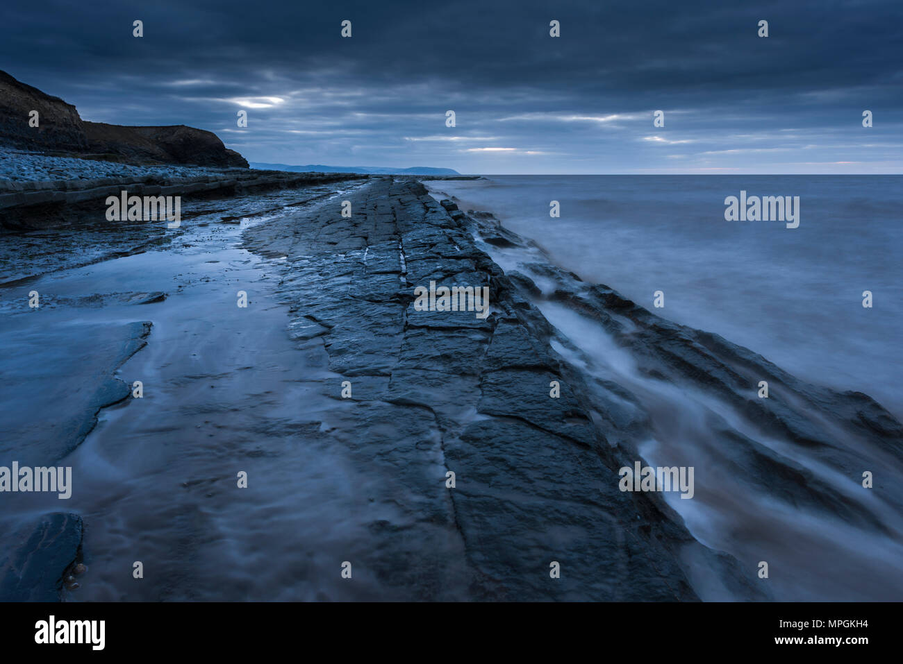 Limestone rock ledges on the shore of the Bristol Channel at Kilve ...