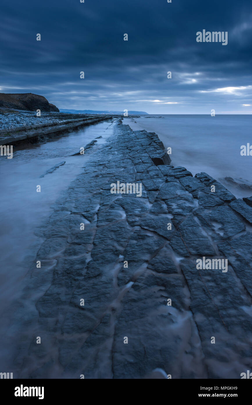 Limestone rock ledges on the shore of the Bristol Channel at Kilve ...