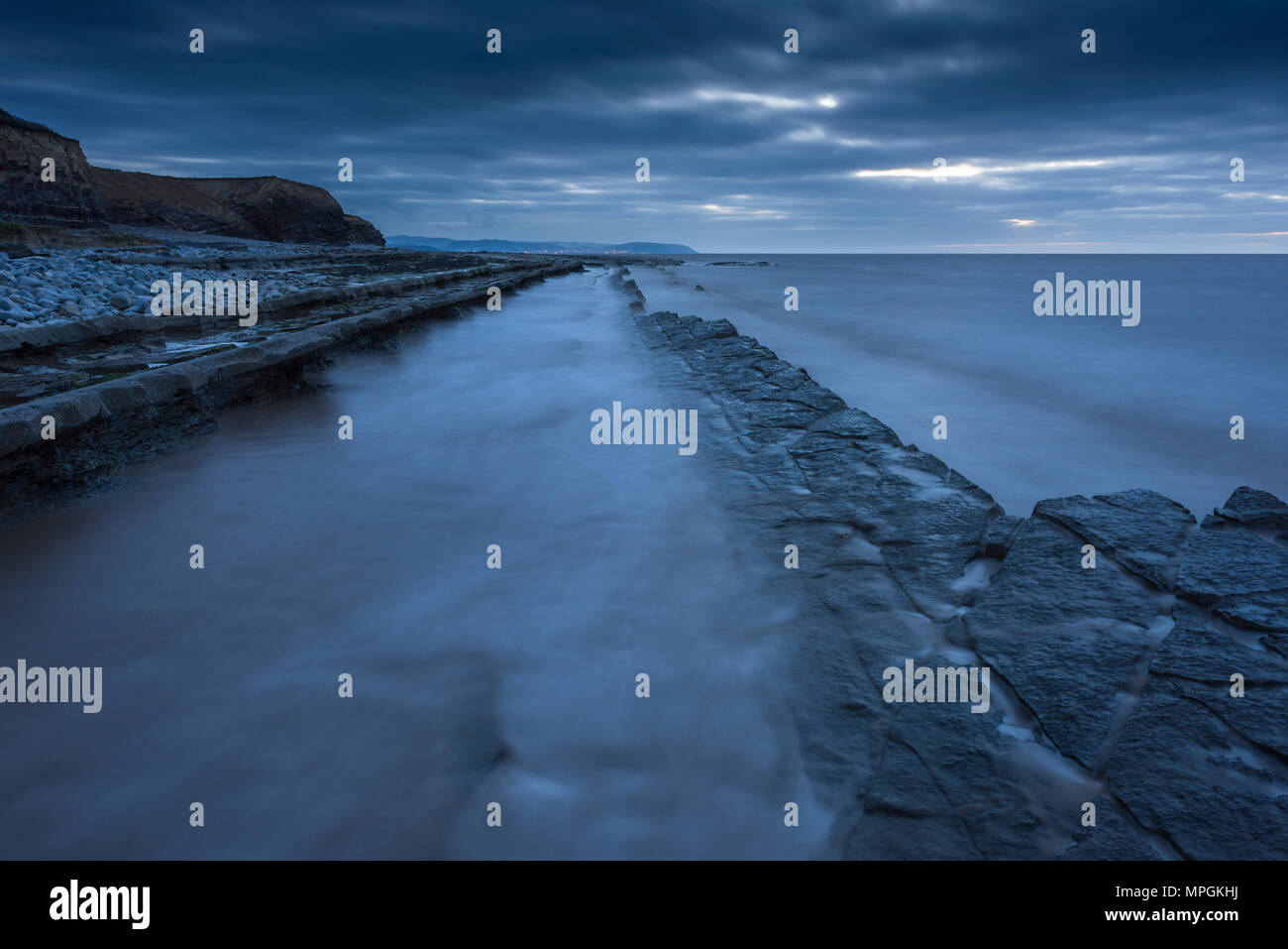 Limestone rock ledges on the shore of the Bristol Channel at Kilve ...