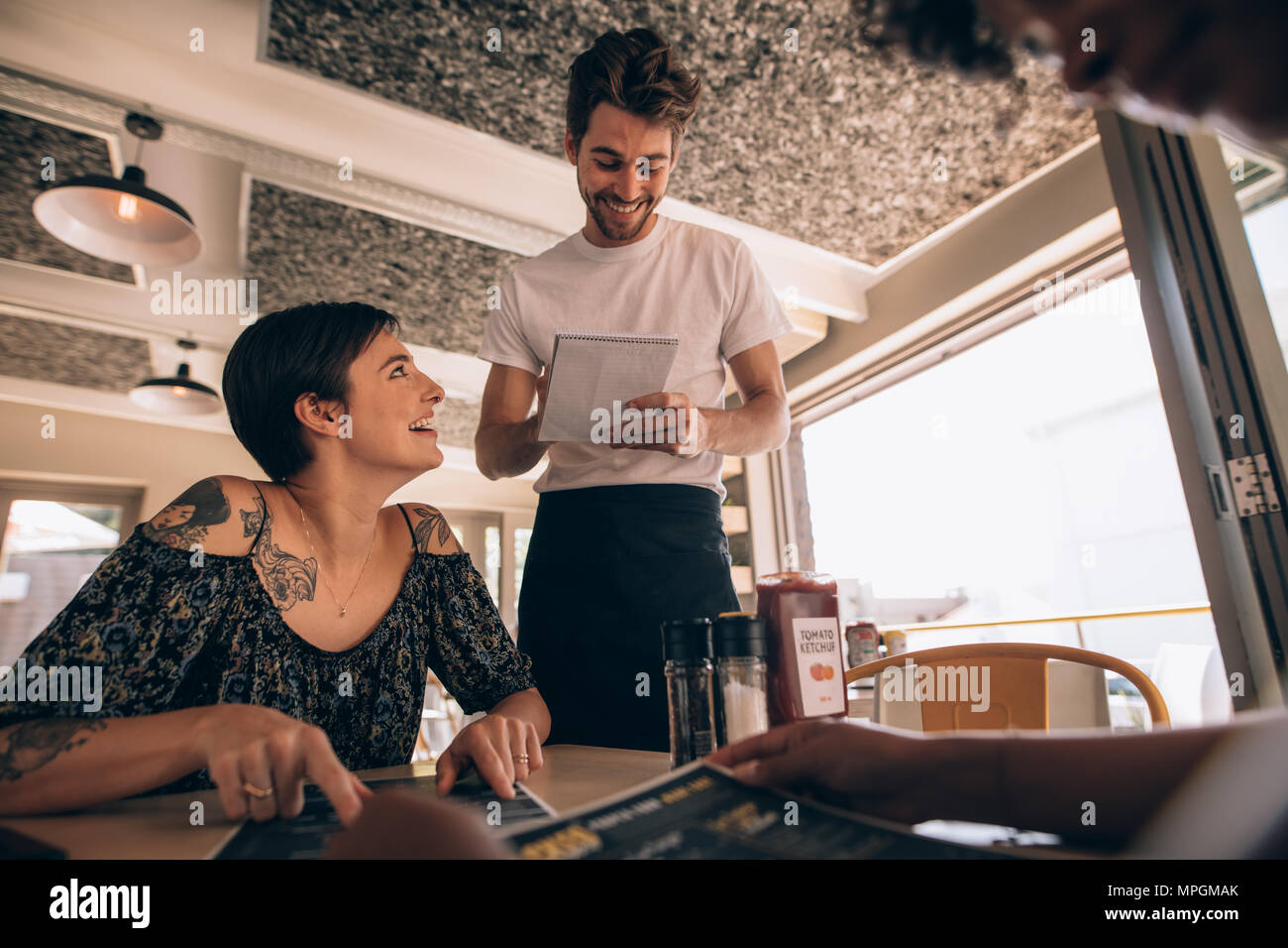 Man woman order restaurant waiter hi-res stock photography and images ...