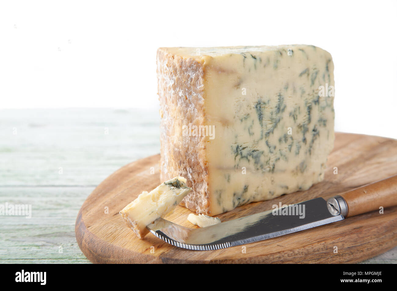 Wedge of Stilton Cheese on a Cheeseboard Stock Photo - Alamy