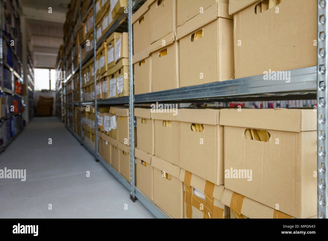 Stacks of files and paperwork placed in bookshelves with folders and ...