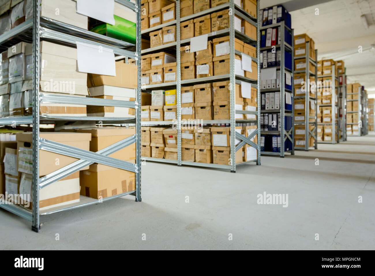 Stacks of files and paperwork placed in bookshelves with folders and ...