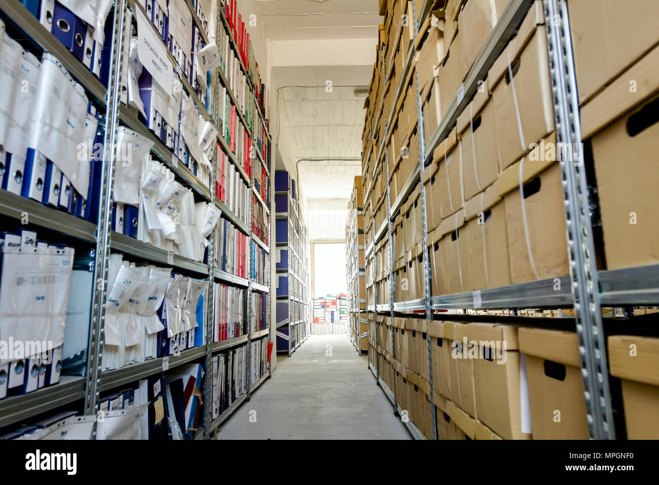 Stacks of files and paperwork placed in bookshelves with folders and ...