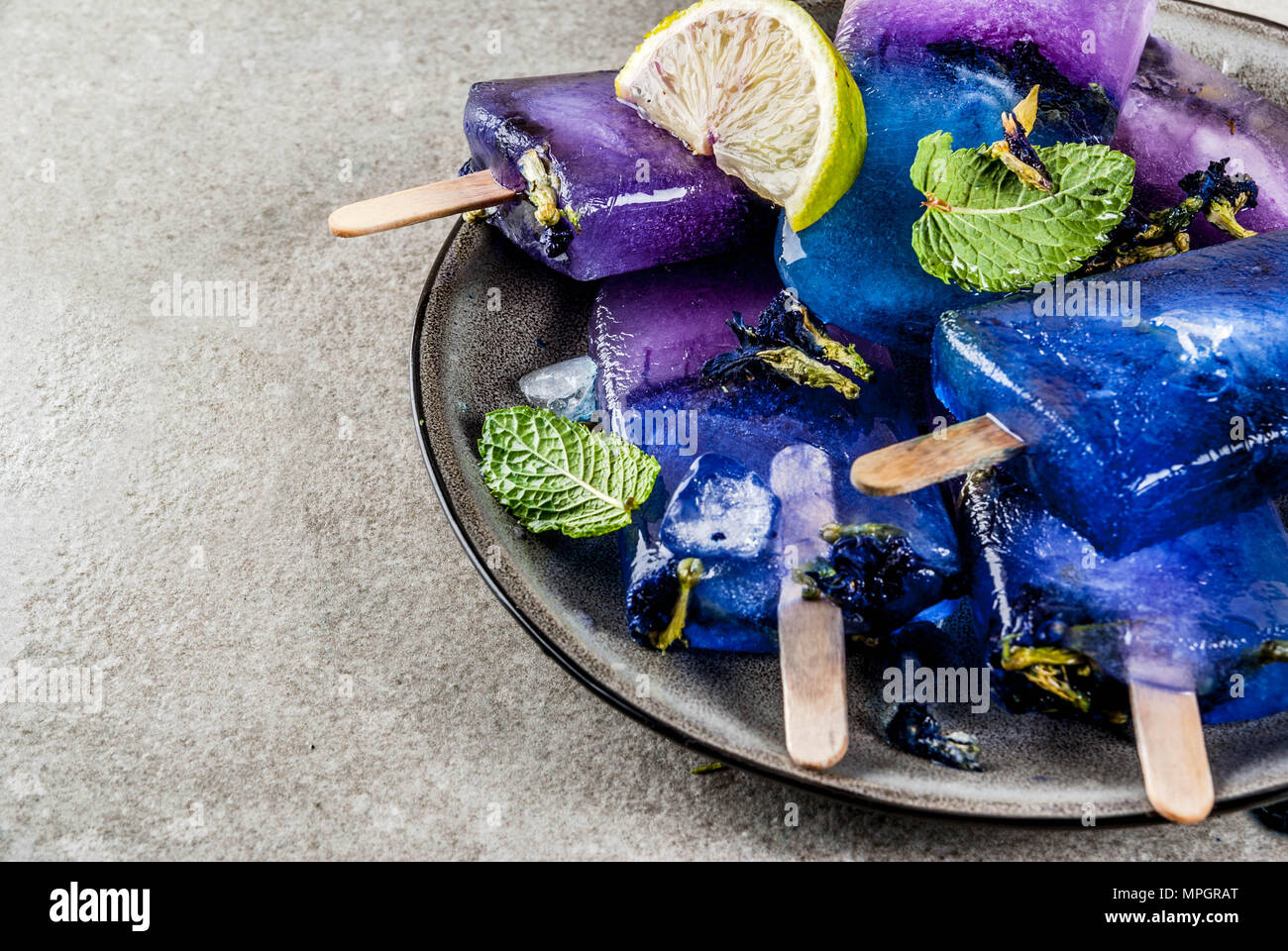 Naturally organic summer sweets, homemade blue and violet ice cream ...