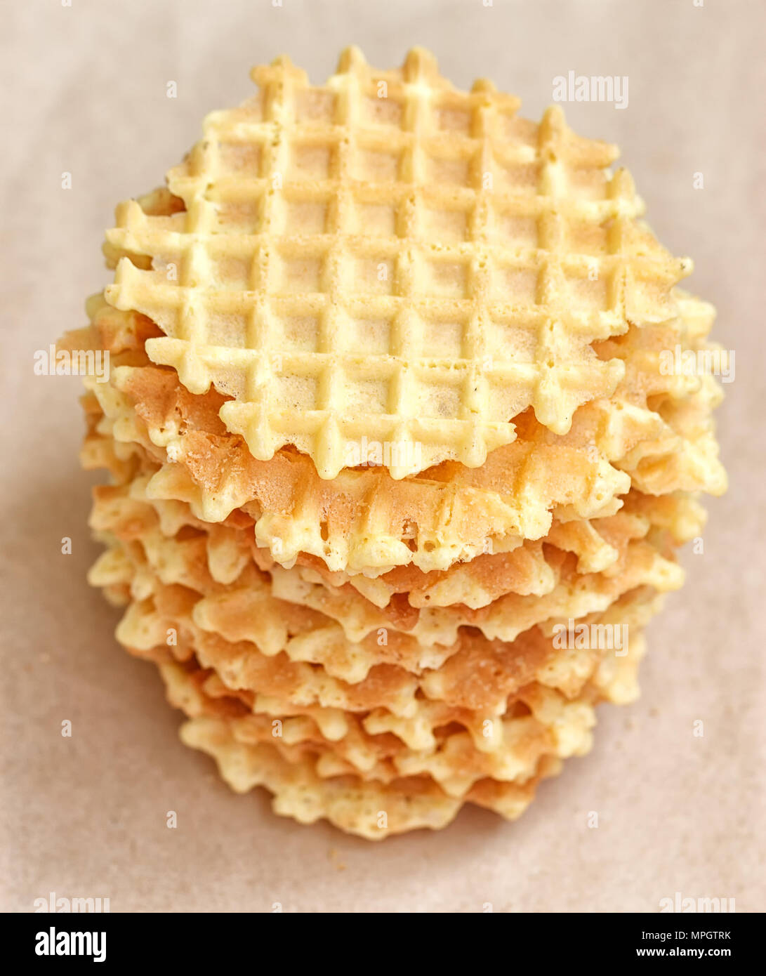 A stack of waffles Belgian round on parchment Stock Photo - Alamy