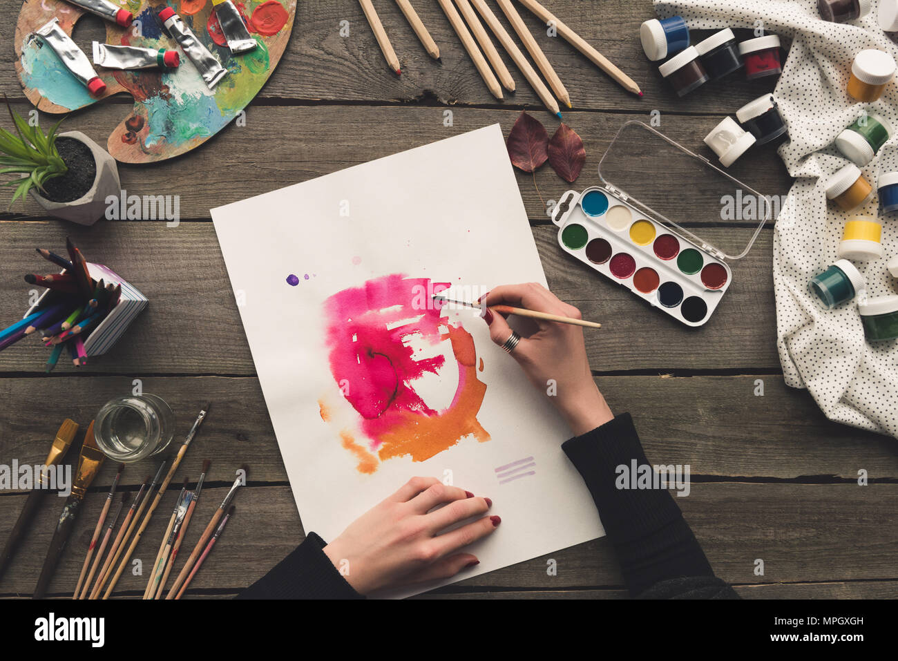 artist drawing with watercolor paints Stock Photo - Alamy